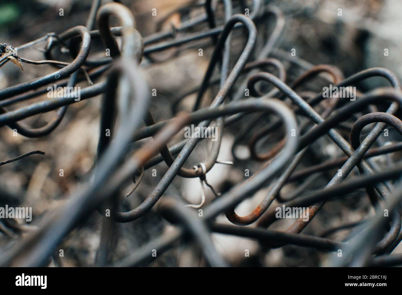 Rusty iron wire. Old mesh netting. Pieces of wire. Scrap metal. Close ...