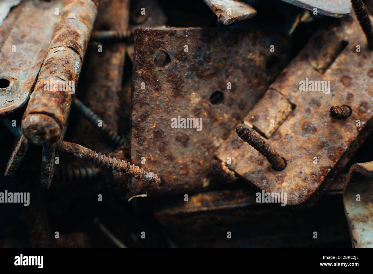 Scrap metal. Rusty screws, latches, curtain. Rust texture. Close-up ...