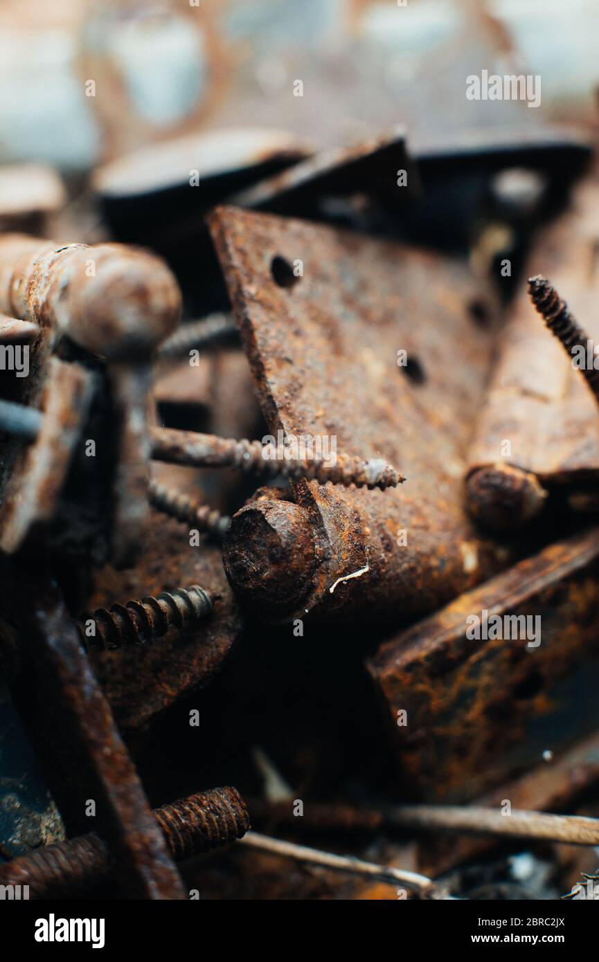 Scrap metal. Rusty screws, latches, curtain. Rust texture. Close-up ...