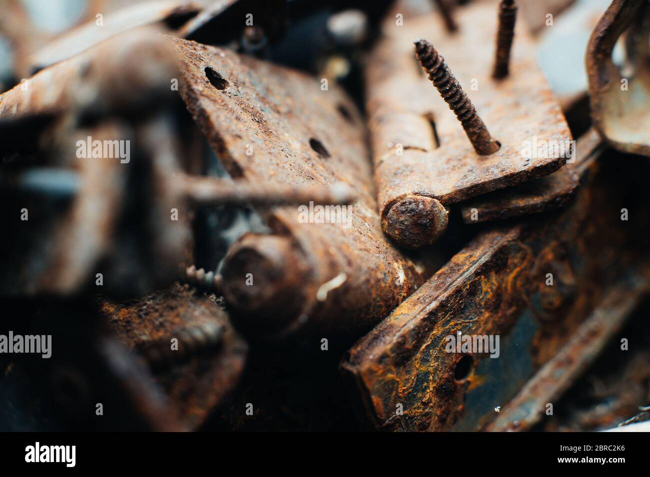 Scrap metal. Rusty screws, latches, curtain. Rust texture. Close-up ...