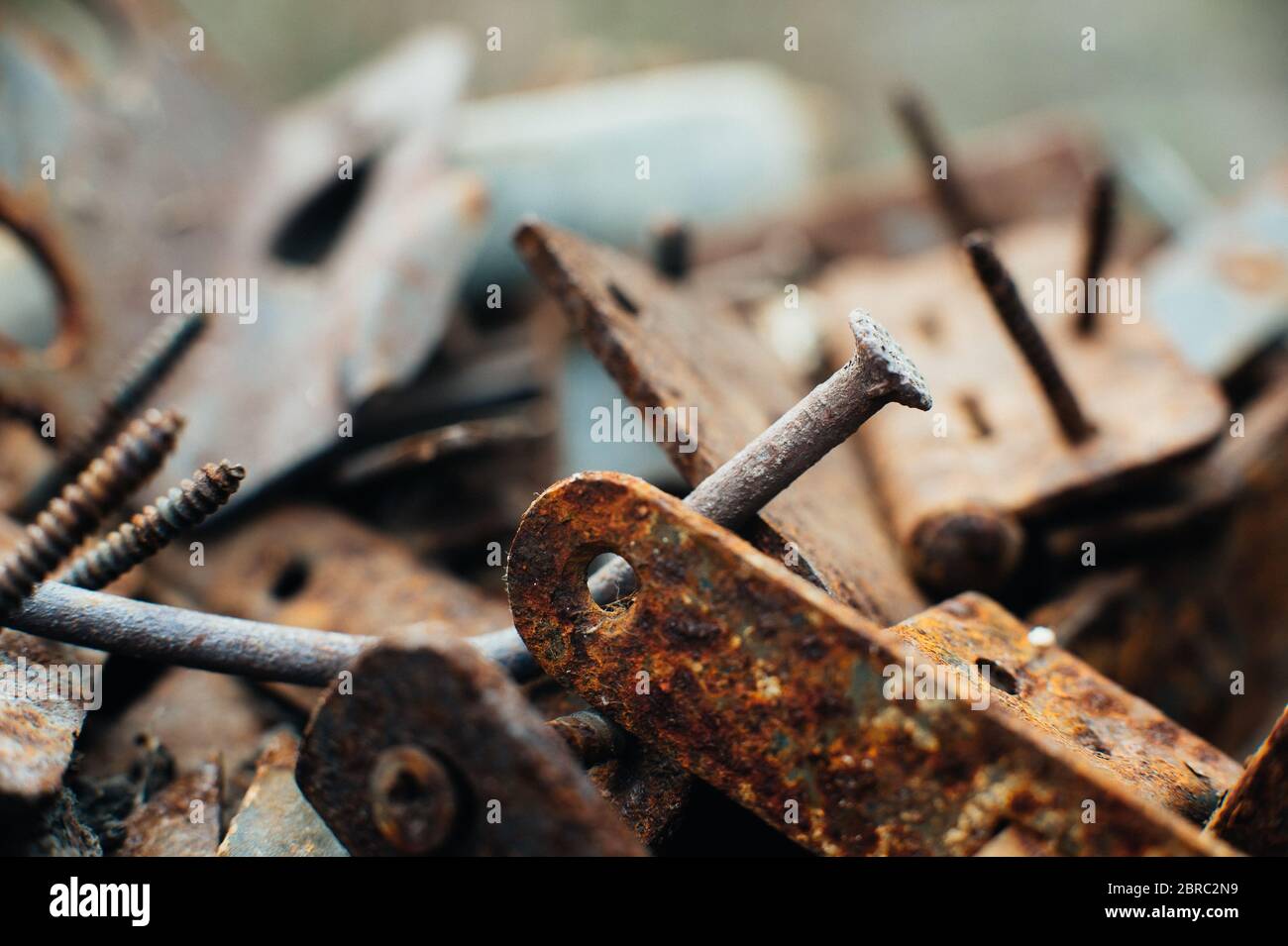 Scrap metal. Rusty screws, latches, curtain. Rust texture. Close-up ...