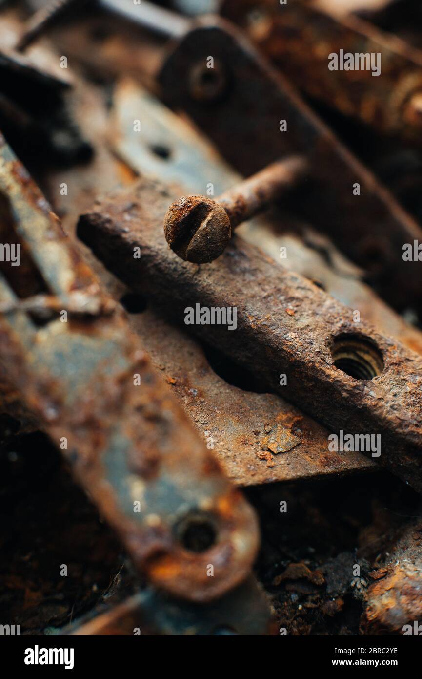 Scrap metal. Rusty screws, latches, curtain. Rust texture. Close-up ...