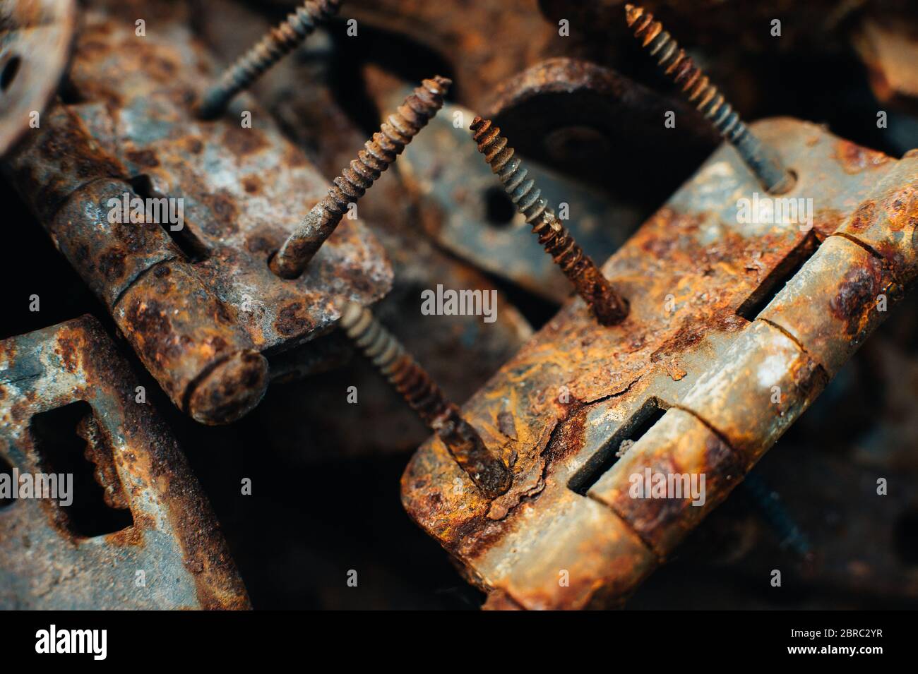 Scrap metal. Rusty screws, latches, curtain. Rust texture. Close-up ...