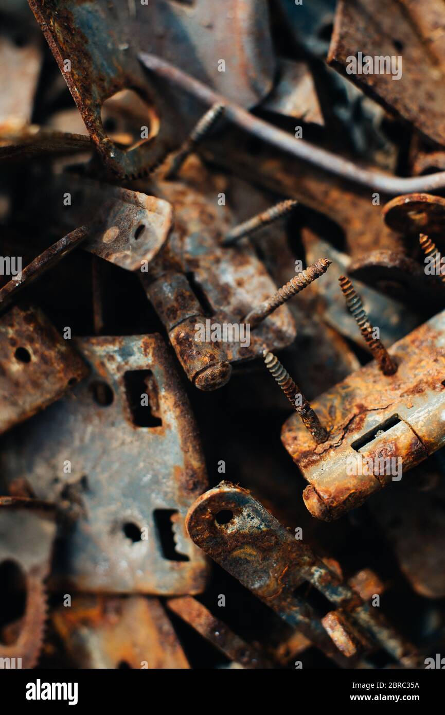 Scrap metal. Rusty screws, latches, curtain. Rust texture. Close-up ...