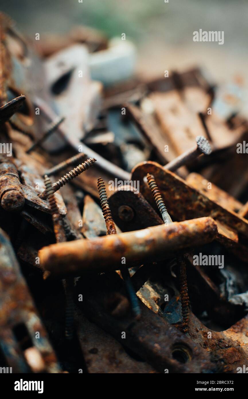 Scrap metal. Rusty screws, latches, curtain. Rust texture. Close-up ...