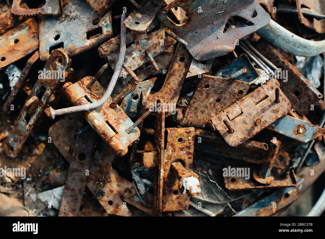 Scrap metal. Rusty screws, latches, curtain. Rust texture. Close-up ...