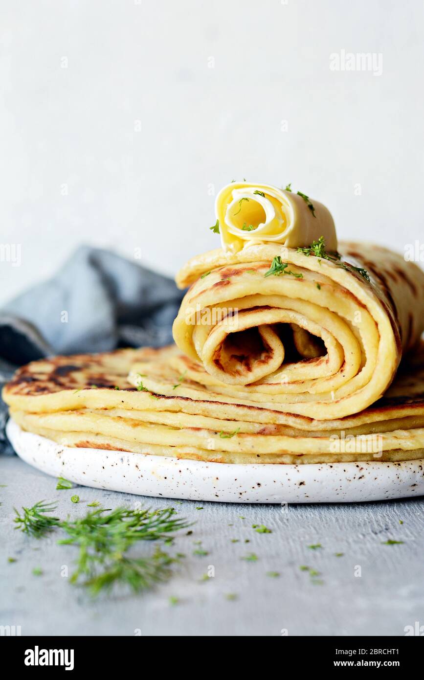 Norwegian potato pancakes Lefse on a light background with cheese and ...