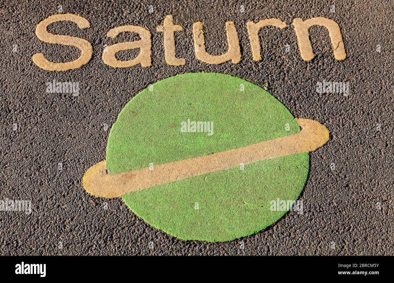 The planet Saturn painted on a path in a play park, Stockton on Tees ...