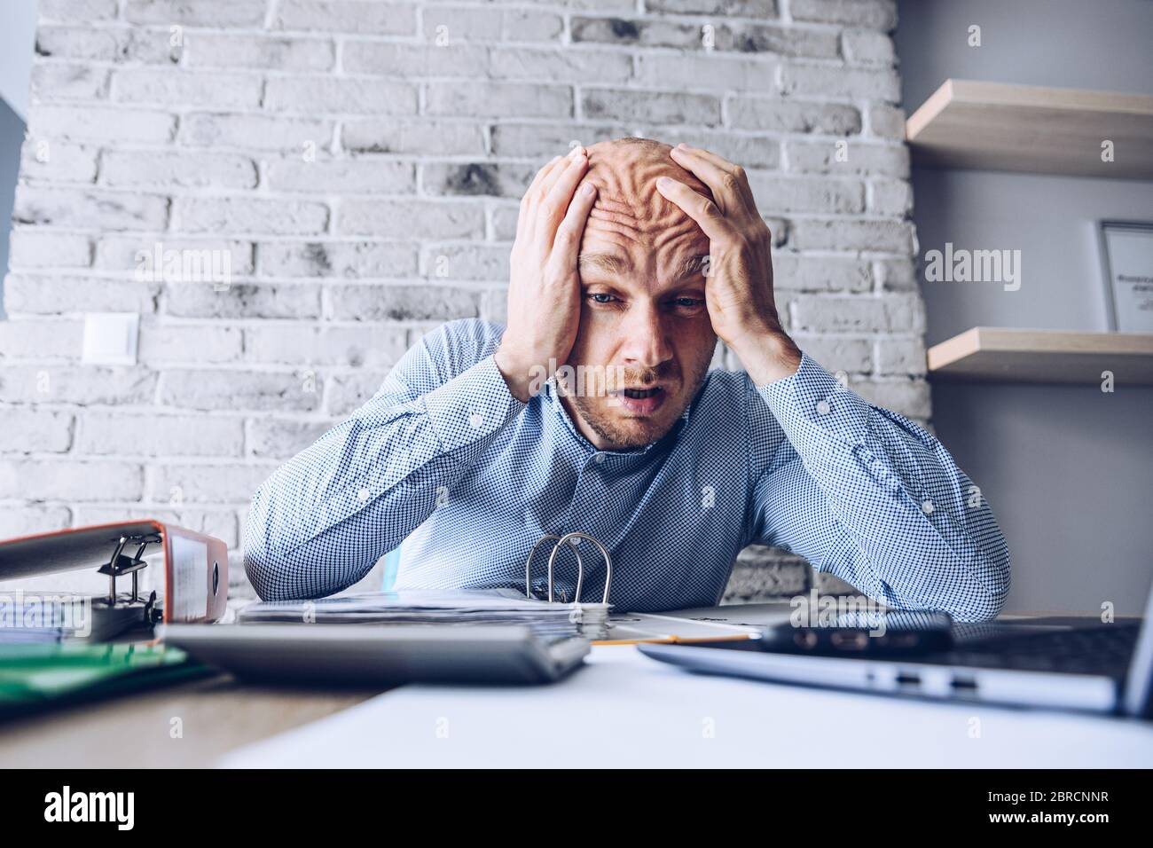 Crying businessman stressed about bankruptcy debt Stock Photo - Alamy