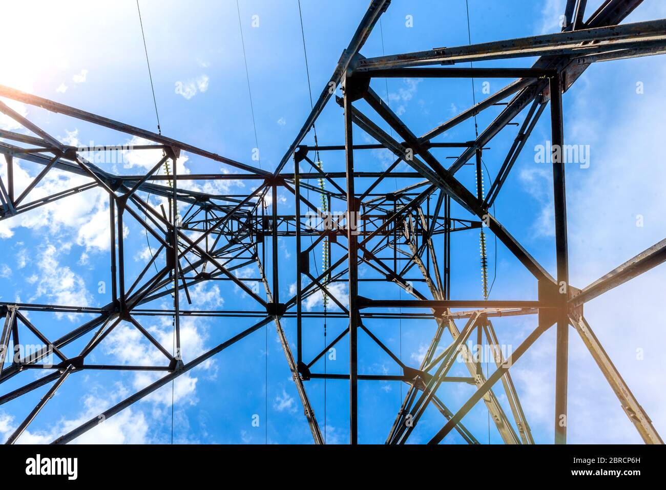 High voltage electric pillar from under. A high-voltage electricity ...