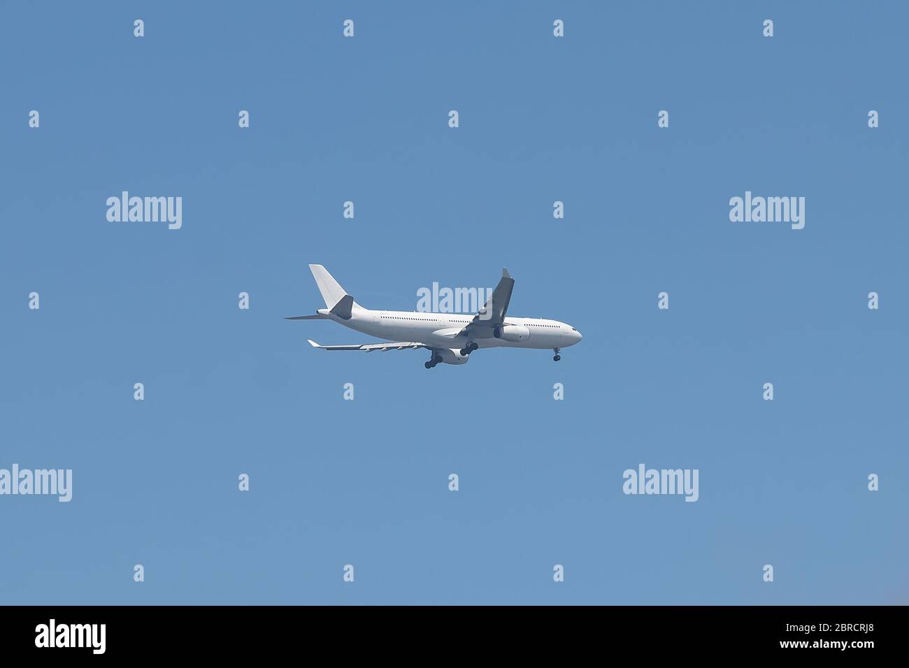 Plane ready for landing with landing gear down Stock Photo - Alamy