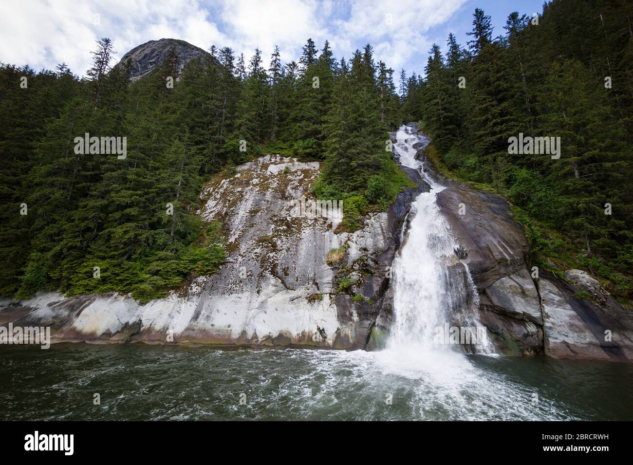 Hole in the Wall Waterfall, Tracy Arm, Southeast Alaska, USA, is a ...