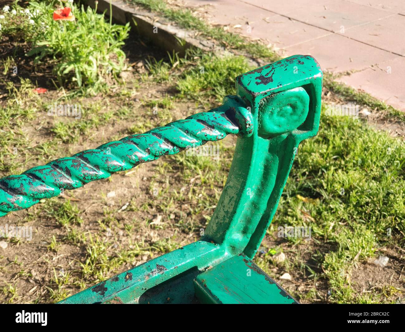 Iron table arm green in public park Stock Photo - Alamy