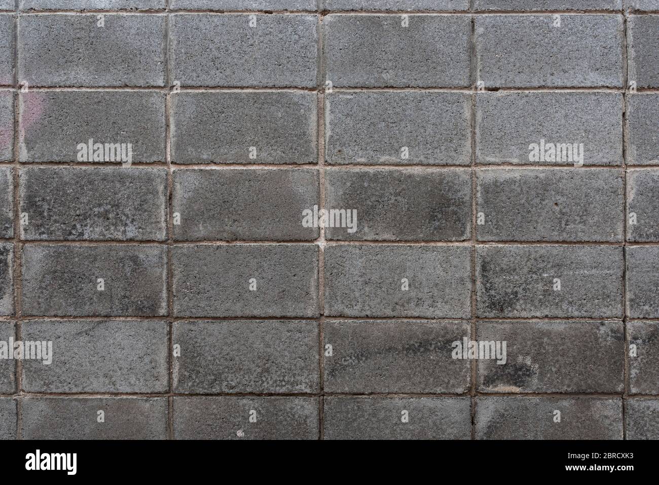 Masonry wall made of gray rectangular stone Stock Photo - Alamy