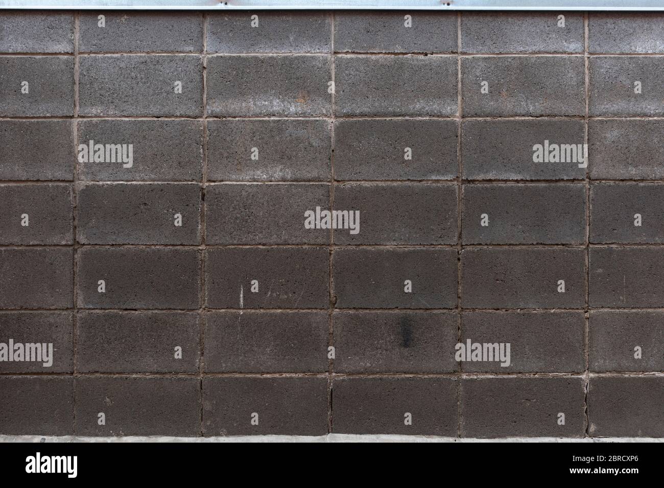 Masonry wall made of gray rectangular stone Stock Photo - Alamy