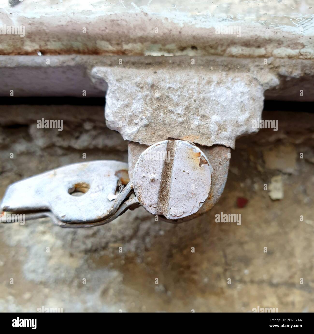 Nut-bolt fitted in an iron old windows. A close view Stock Photo - Alamy
