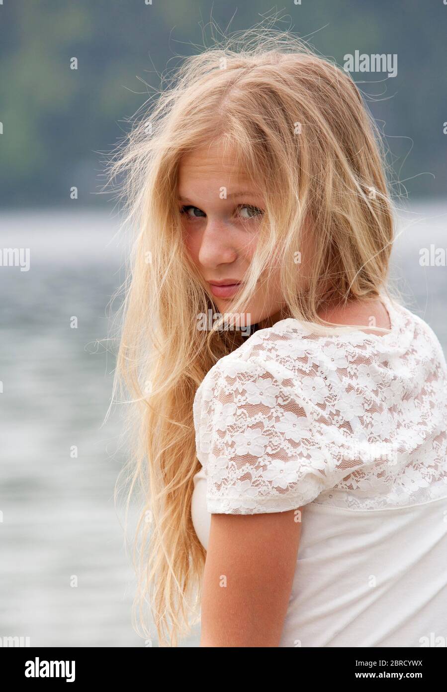 Portrait of a blonde girl, looks sceptically back, Austria Stock Photo ...