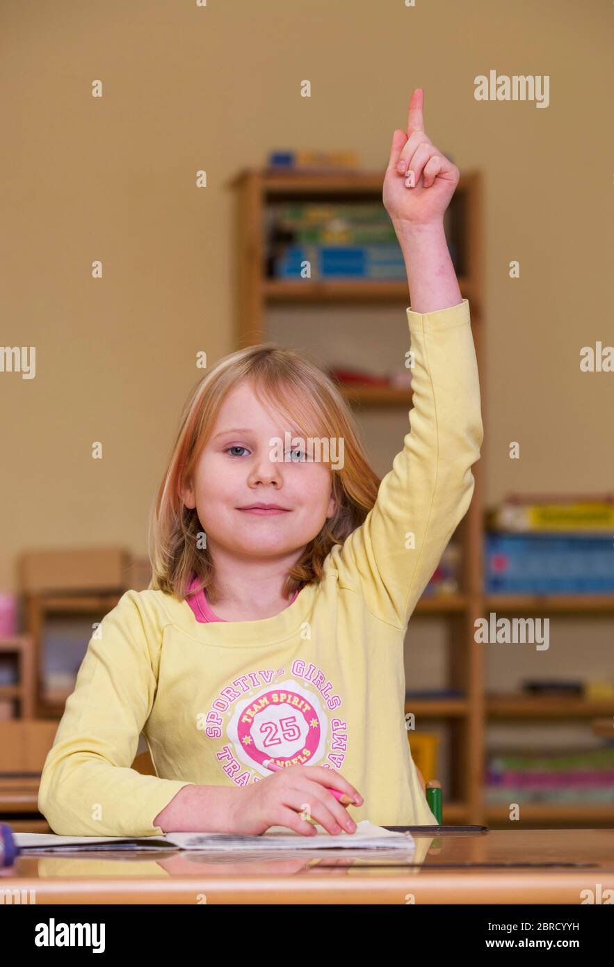 Pupil sitting in a classroom and reporting for class hi-res stock ...