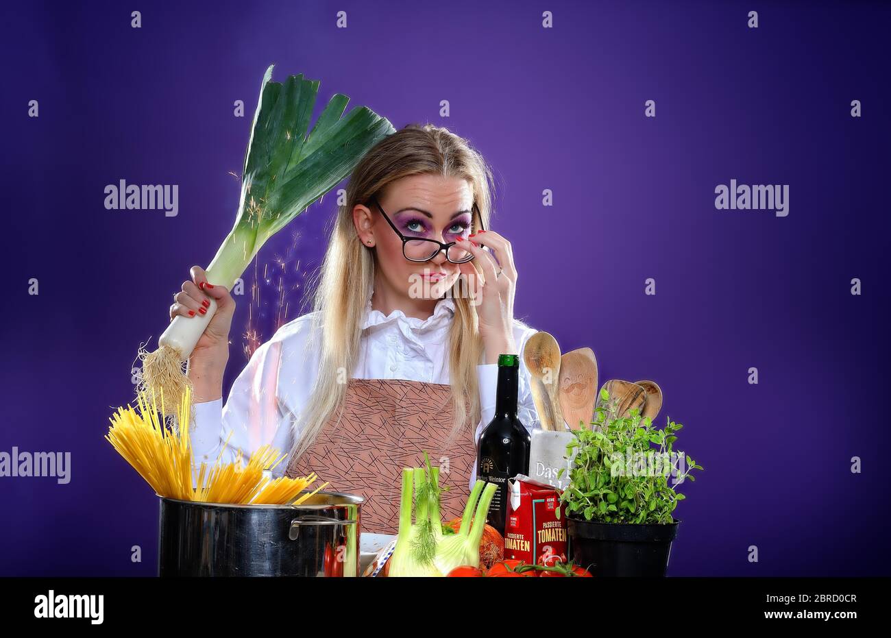 Young woman cooking, Germany Stock Photo - Alamy