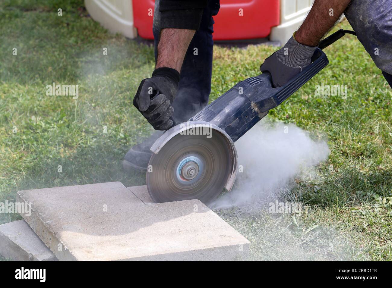 Industrial construction worker using a professional angle grinder Stock ...