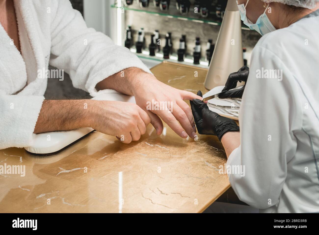 Manicure master during professional hardware hi-res stock photography ...