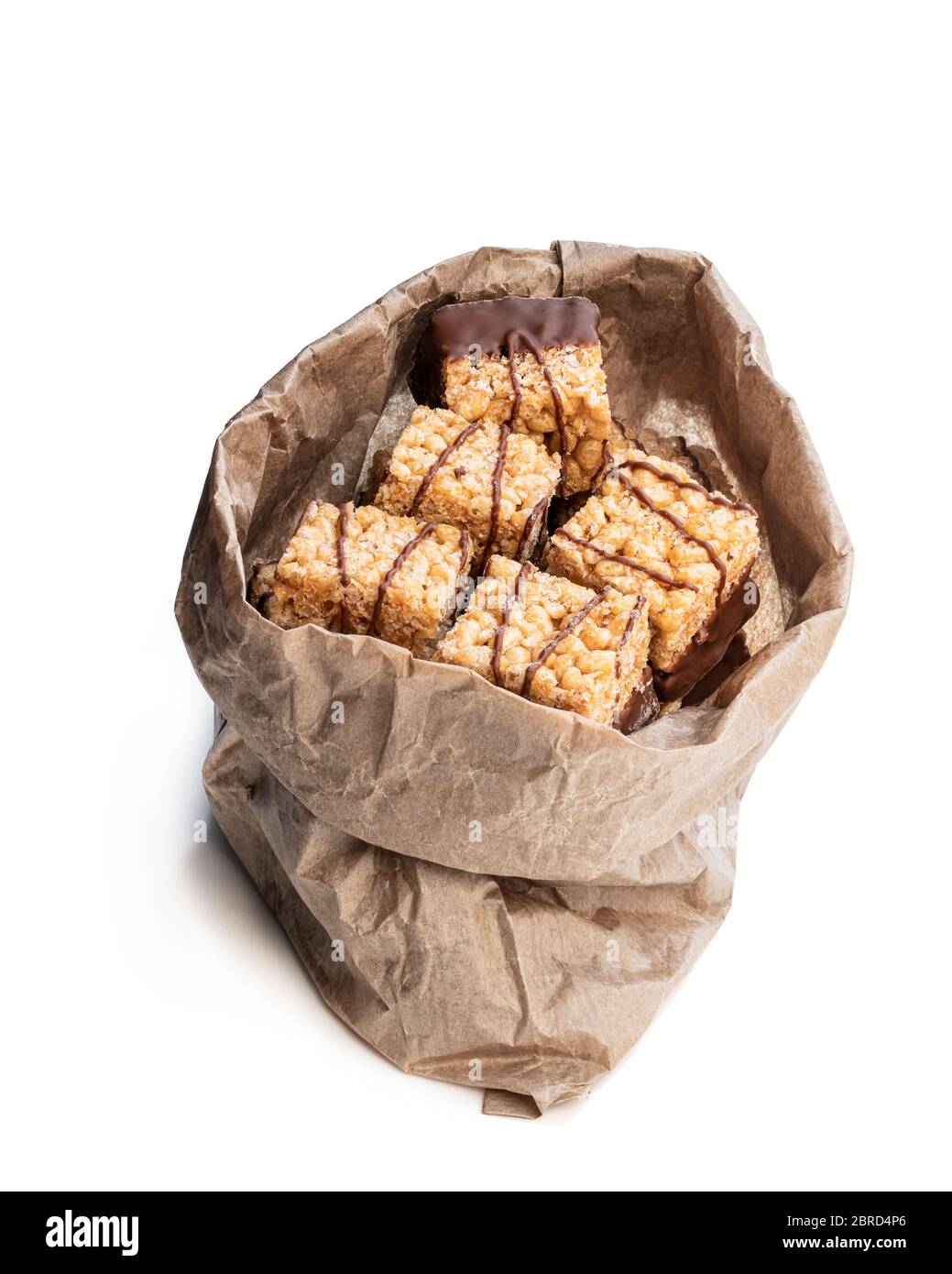 Mini rice and syrup flapjack slices in paper bag isolated on white ...