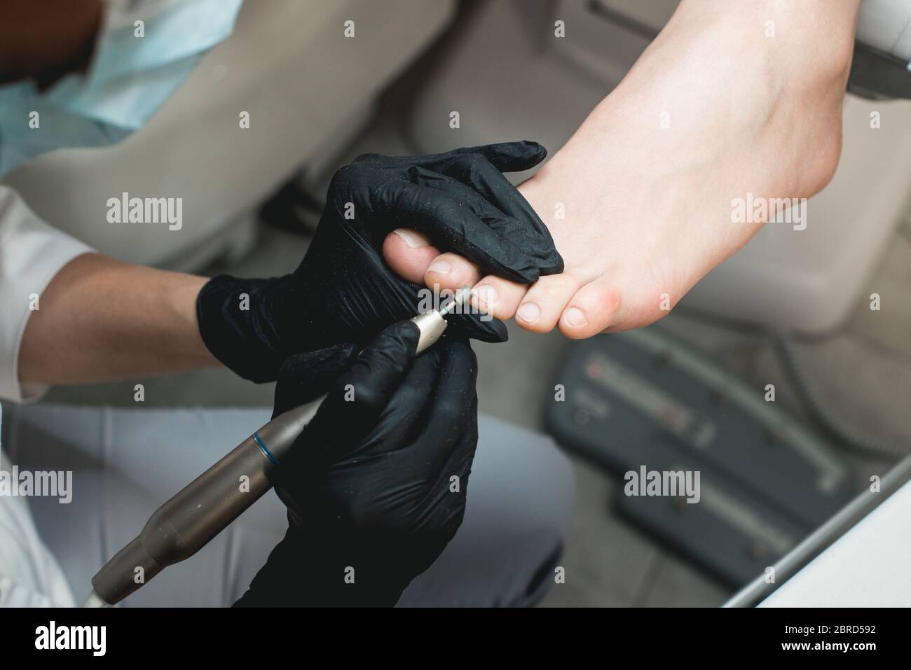 Professional hardware pedicure using electric machine.Patient on ...