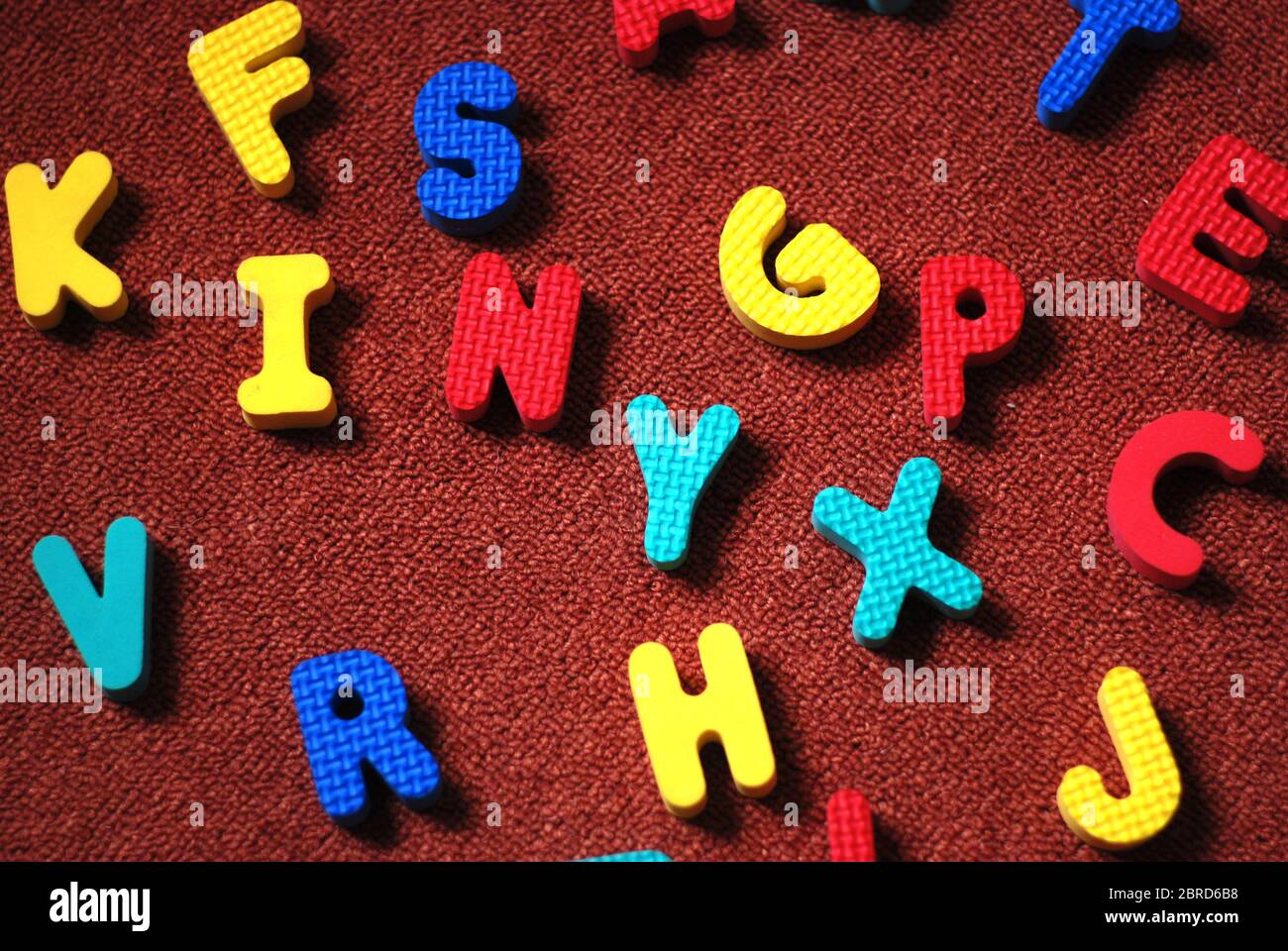 Kids letters learning on the red carpet Stock Photo - Alamy