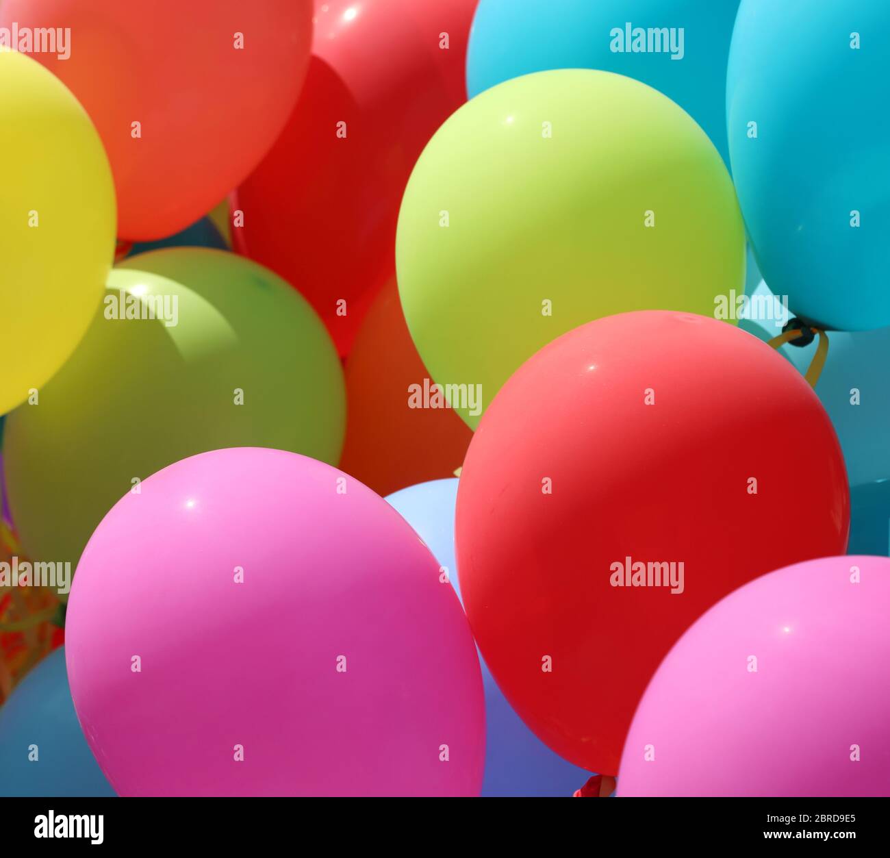 background of large colored balloons inflated with helium gas to cheer ...