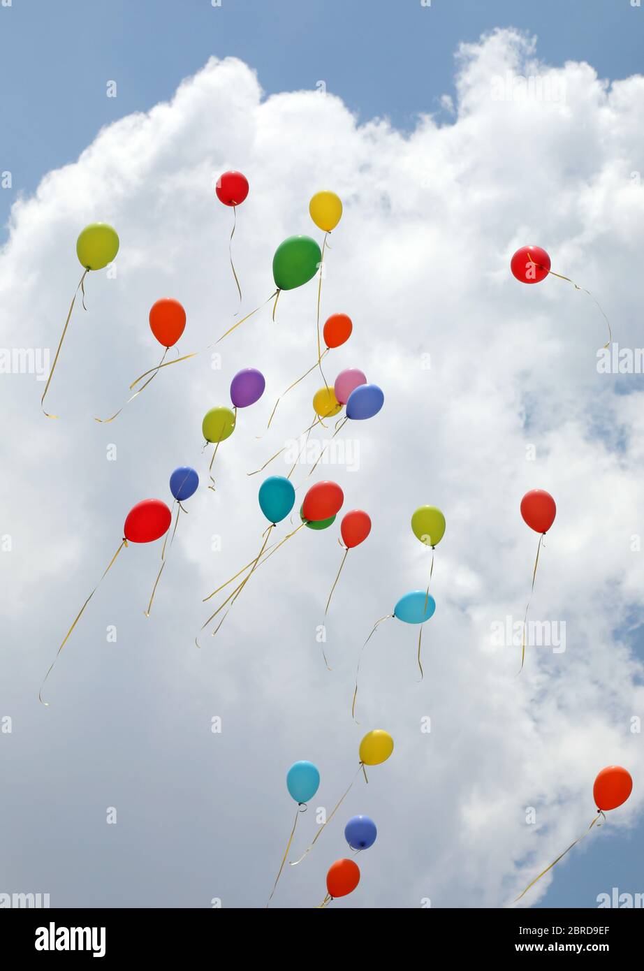 colorful balloons inflated with helium flying high in the sky during ...