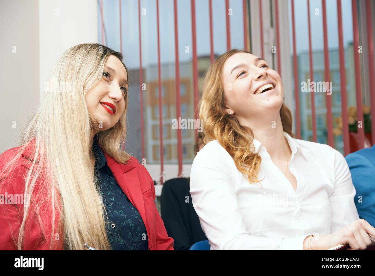 happy office workers managers laughing at meeting Stock Photo - Alamy