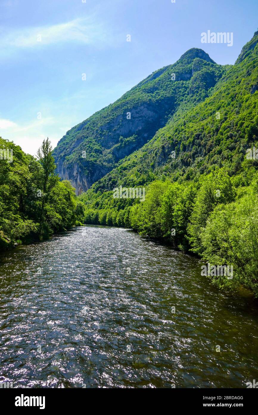 Springtime greenery and the Ariege river flowing through the Pyrenees ...