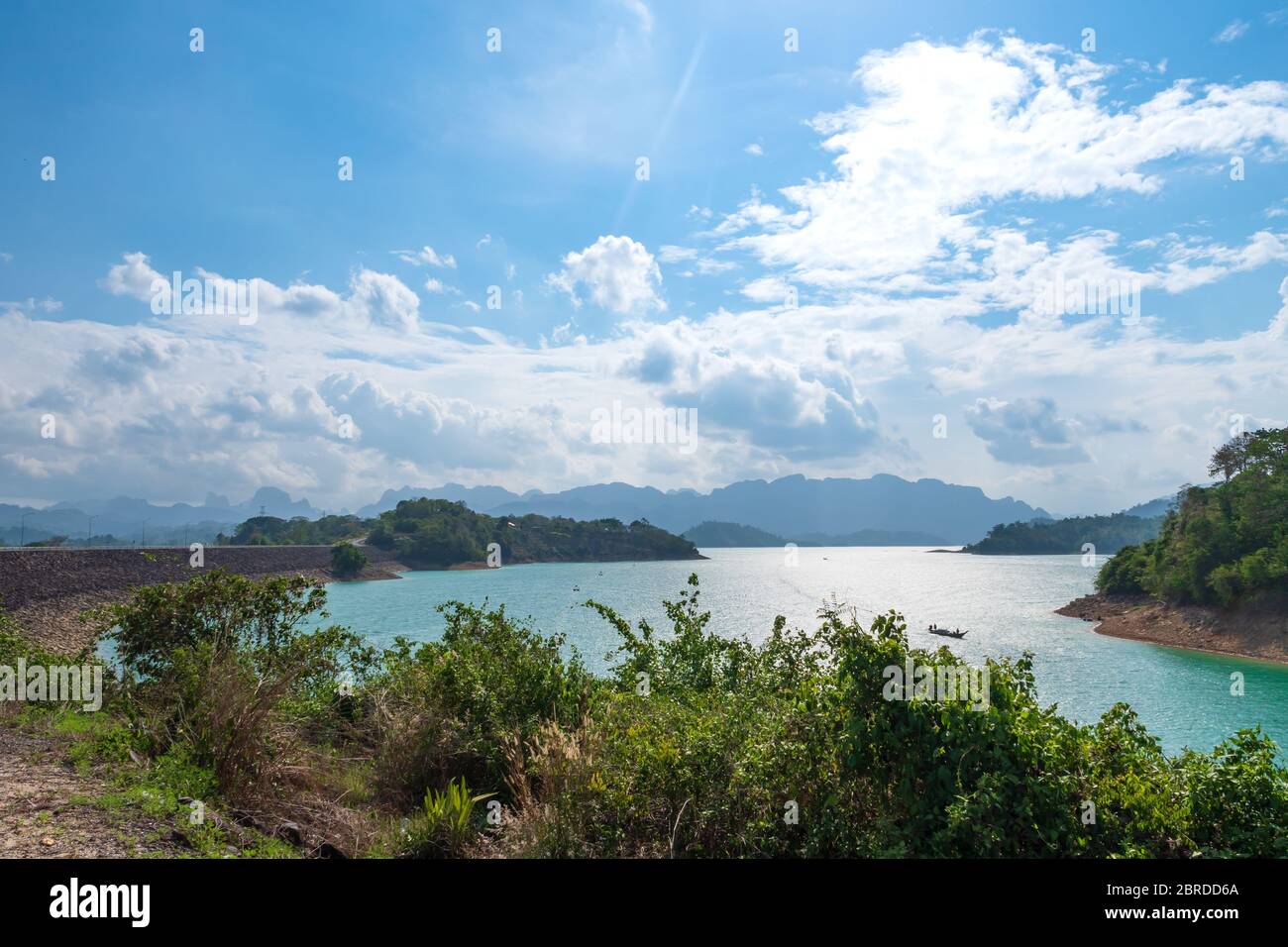 Scenic landscape of big river and reservoir dam with mountain and ...