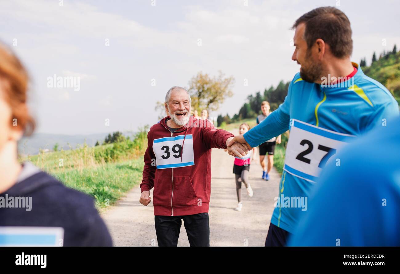 Child running race numbers hi-res stock photography and images - Alamy