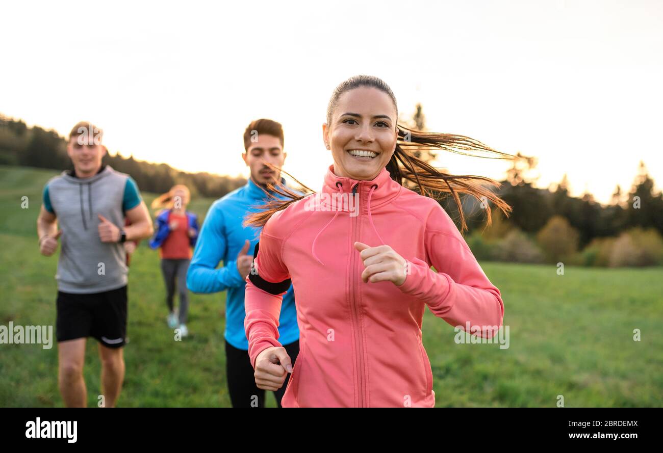A large group of people cross country running in nature Stock Photo - Alamy