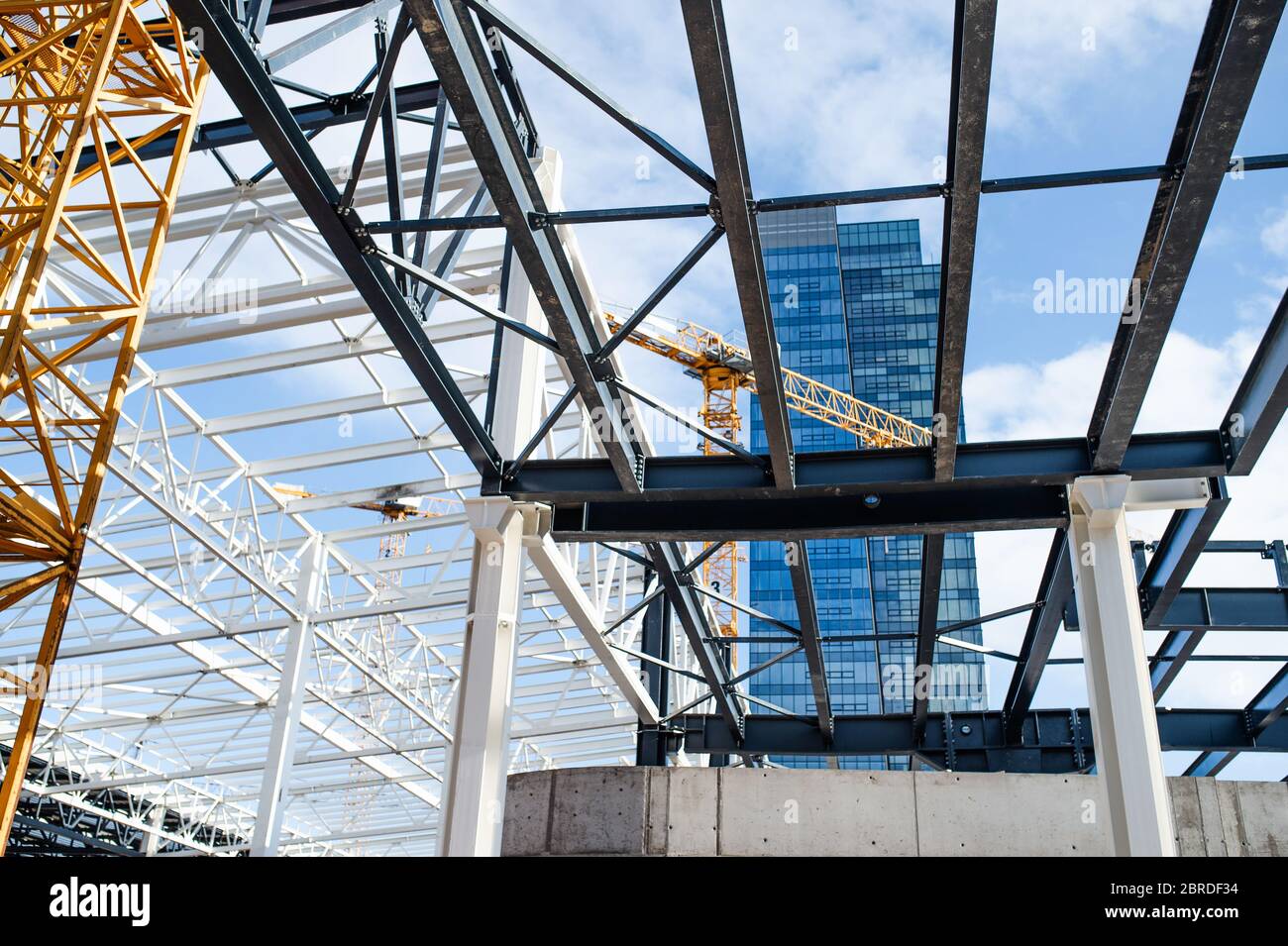 Construction site with steel frame structure and crane Stock Photo - Alamy