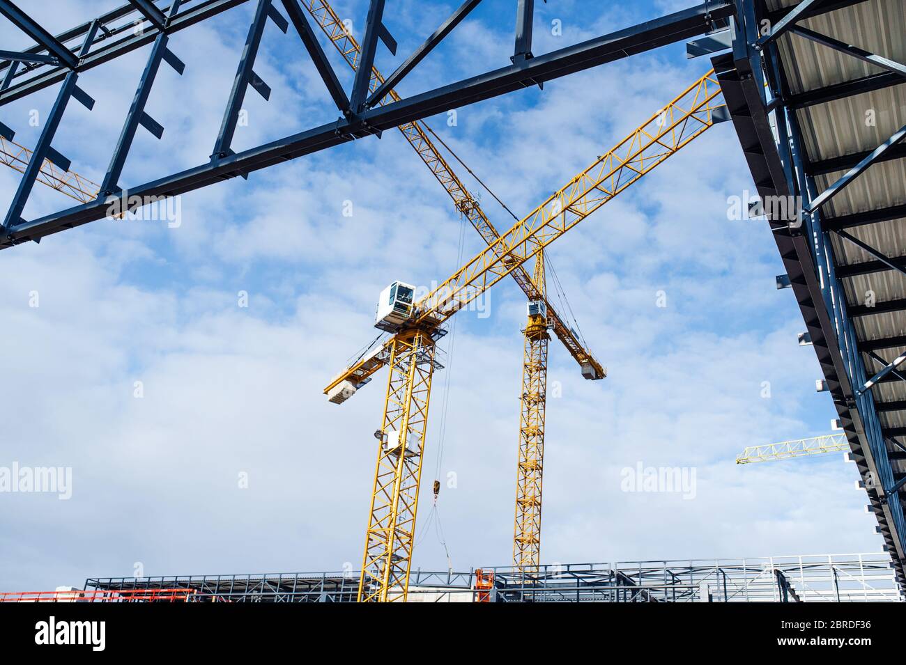 Construction site with steel frame structure and crane Stock Photo - Alamy
