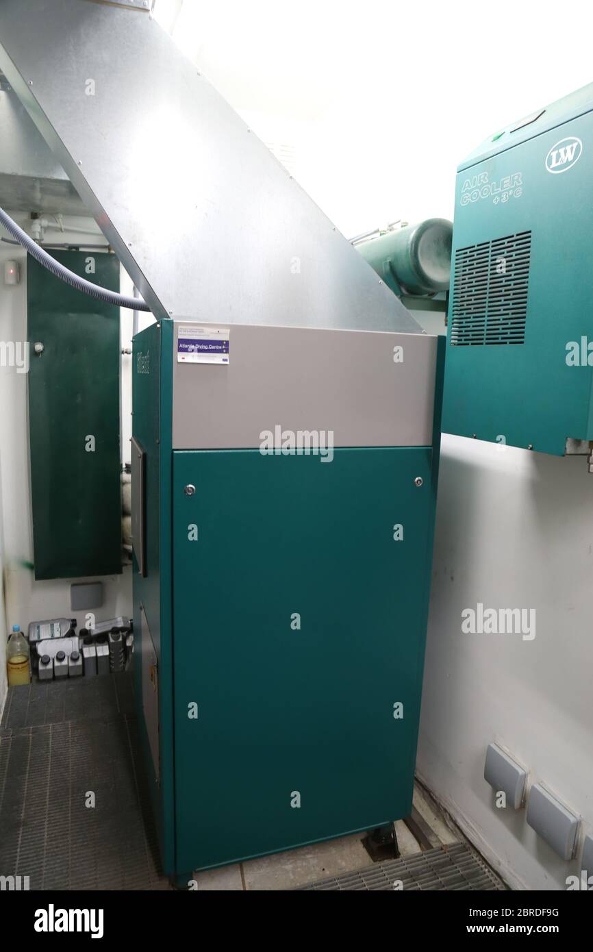 A Scuba diving compressor in equipment storage room Stock Photo - Alamy