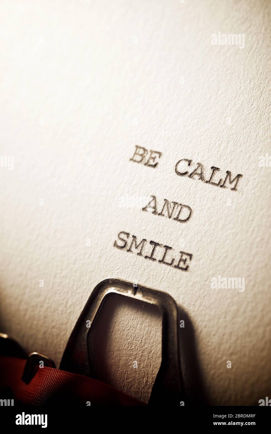 Be calm and smile text written with a typewriter Stock Photo - Alamy