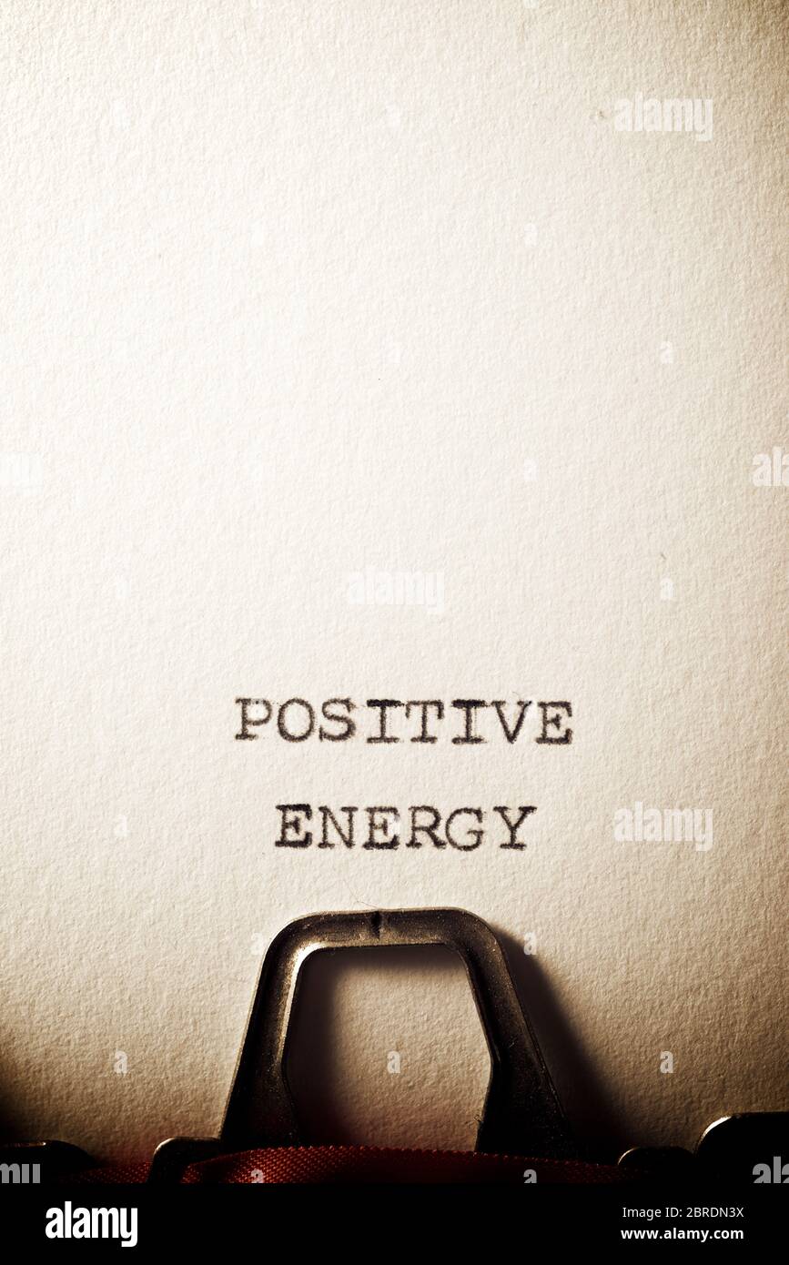 Positive energy text written with a typewriter Stock Photo - Alamy