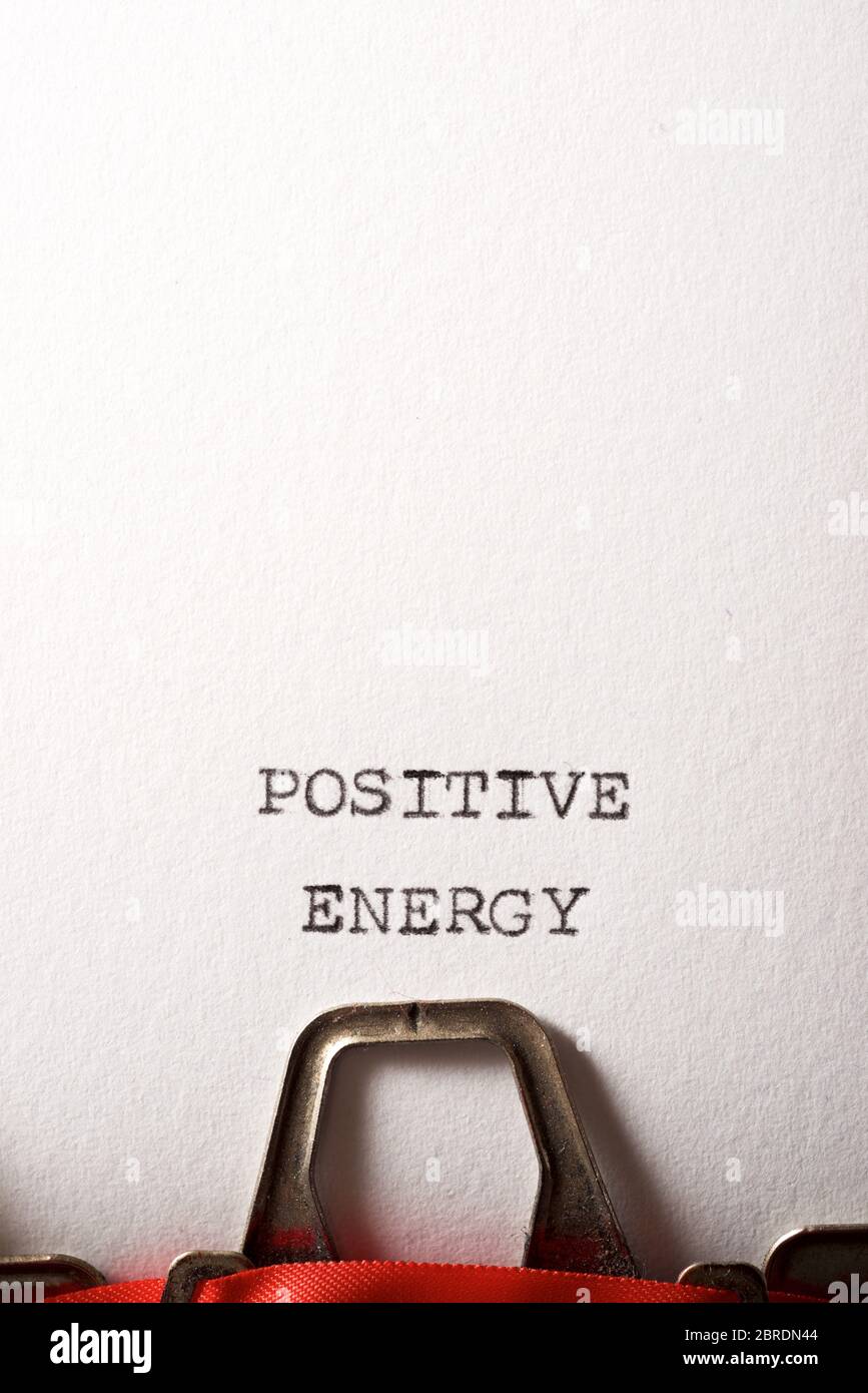 Positive energy text written with a typewriter Stock Photo - Alamy