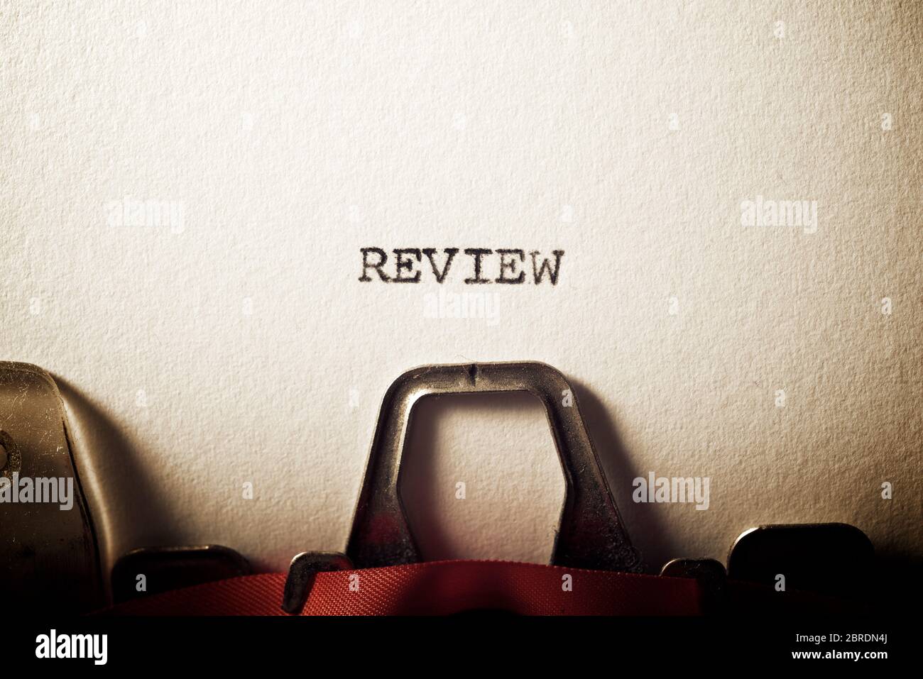 Review word written with a typewriter Stock Photo - Alamy