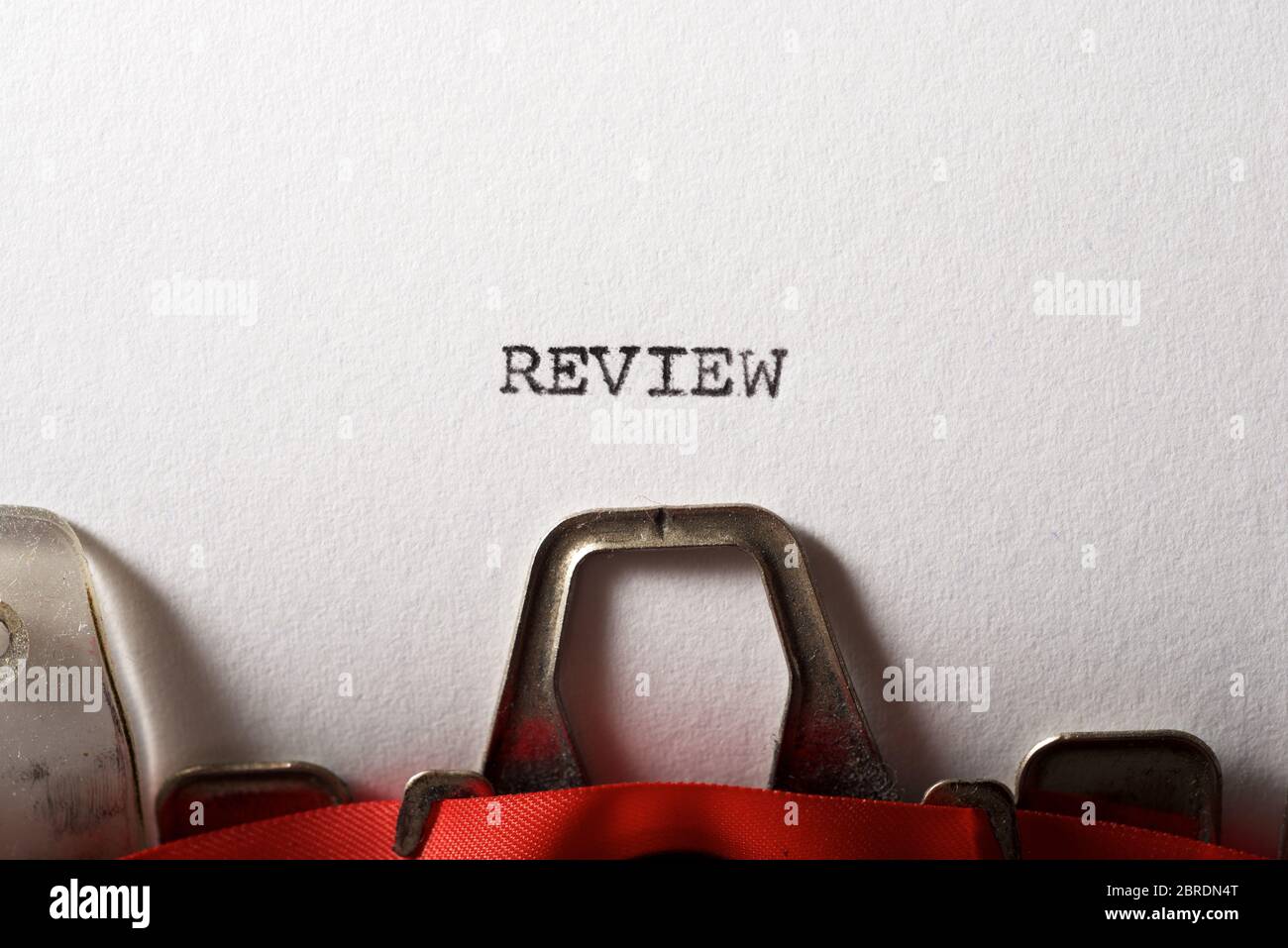 Review word written with a typewriter Stock Photo - Alamy