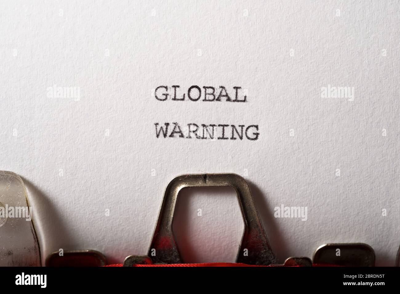 Global warning text written with a typewriter Stock Photo - Alamy