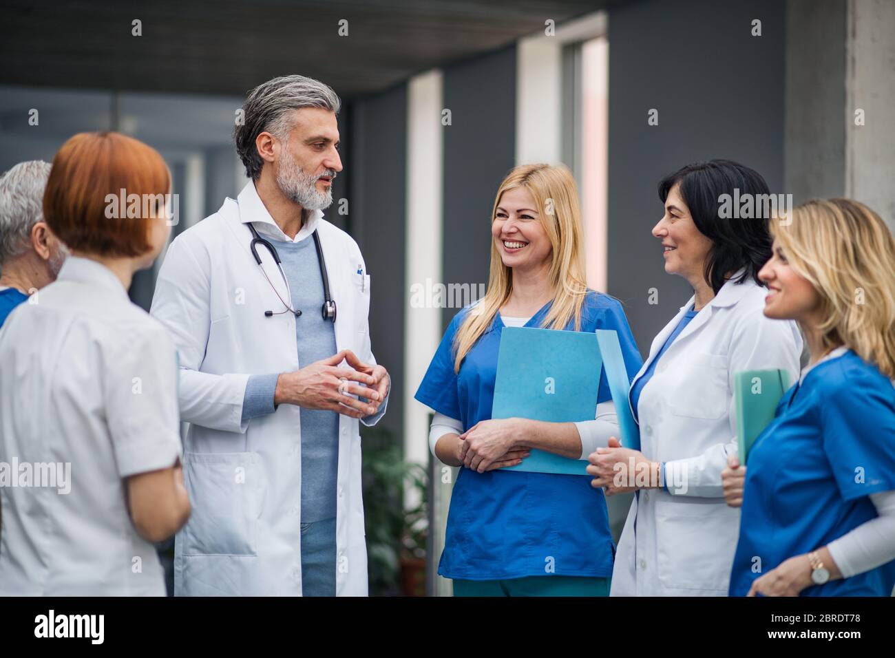 Group of doctors standing in hospital on medical conference Stock Photo ...