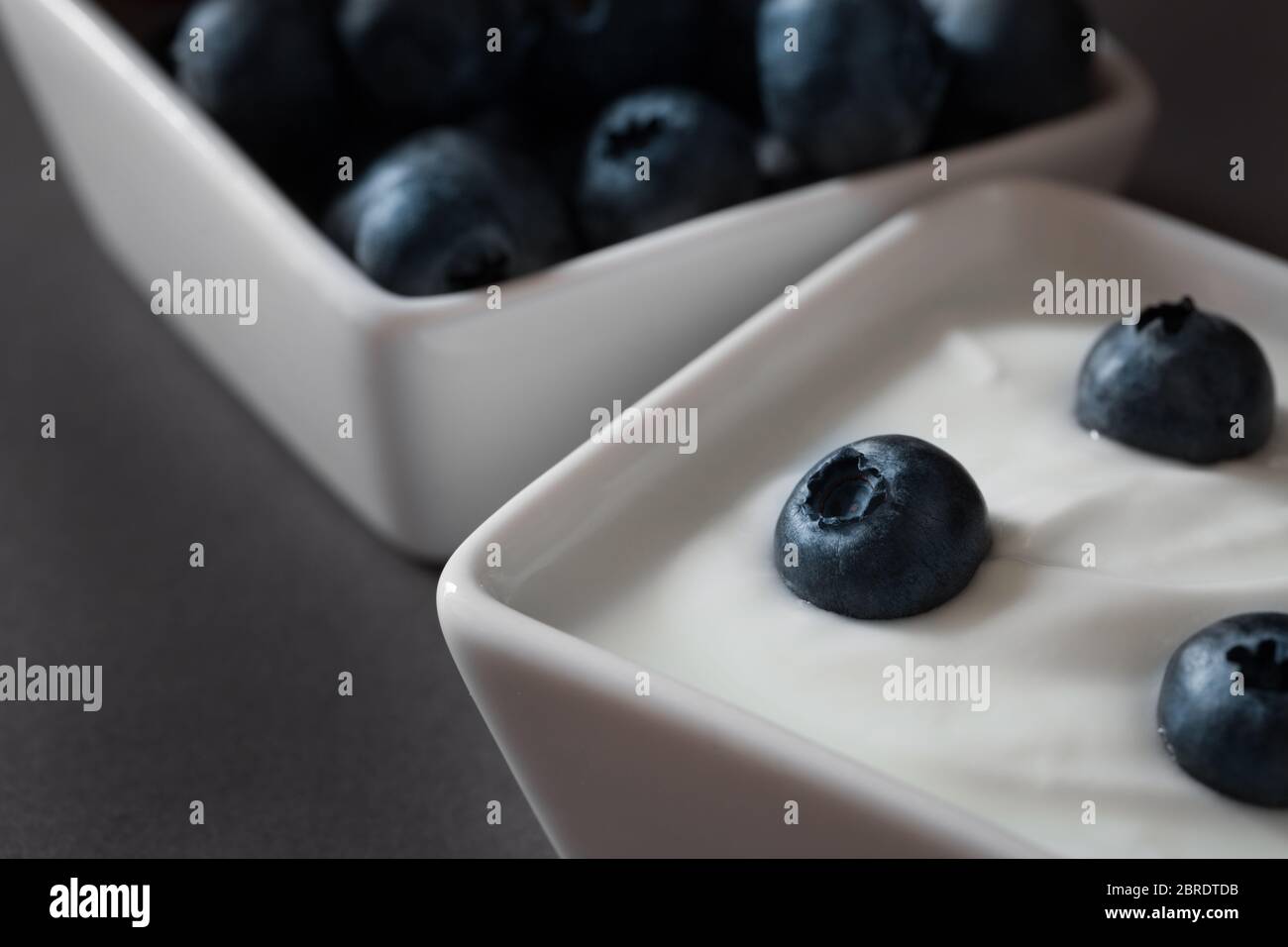 Yogurt and blueberries still life Stock Photo - Alamy