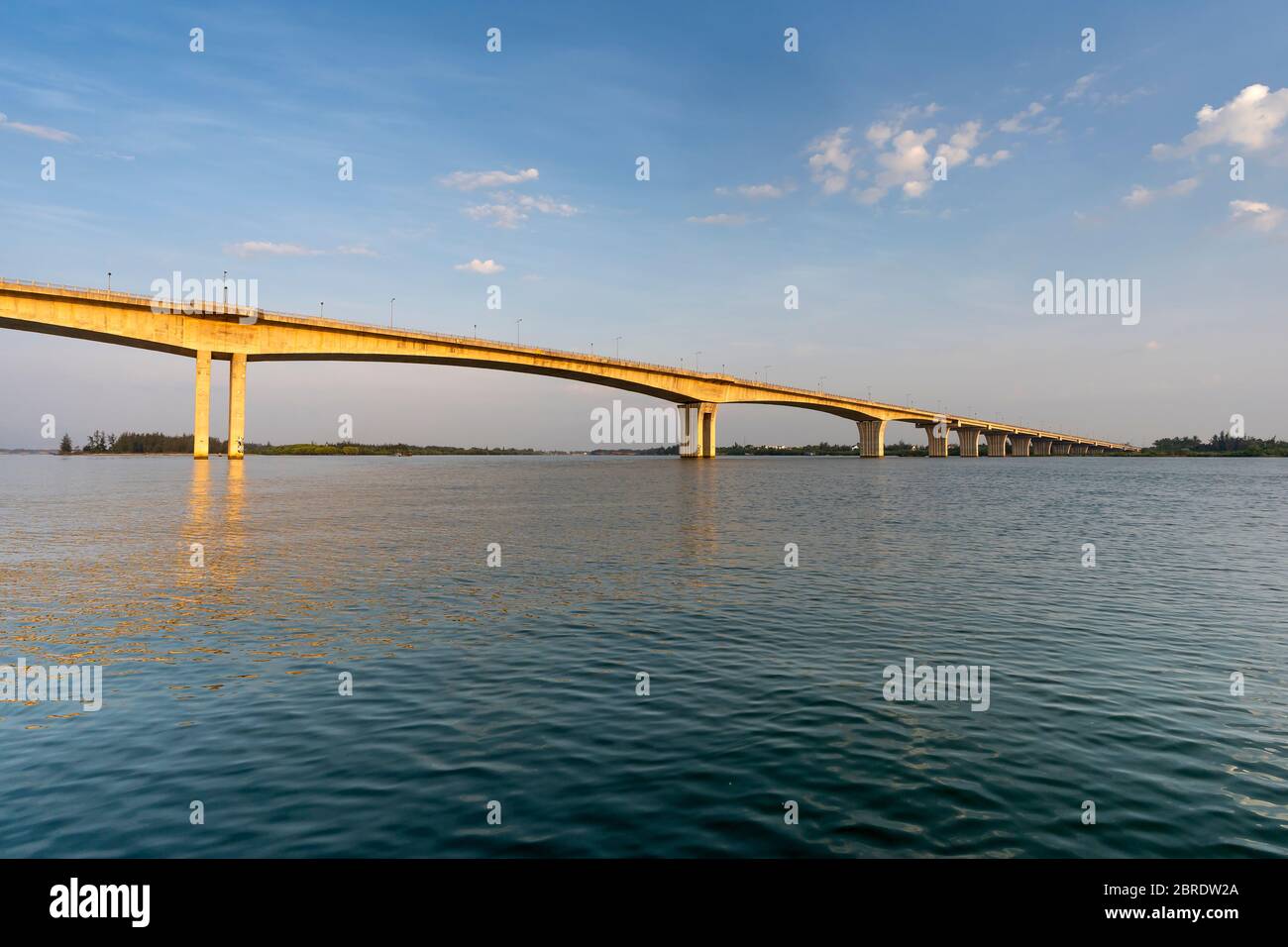 Dawn on the Cua Dai Bridge. Cua Dai Bridge crosses the Thu Bon River ...