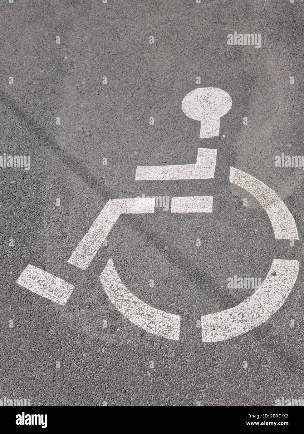 Painted handicap sign in a parking lot Stock Photo - Alamy