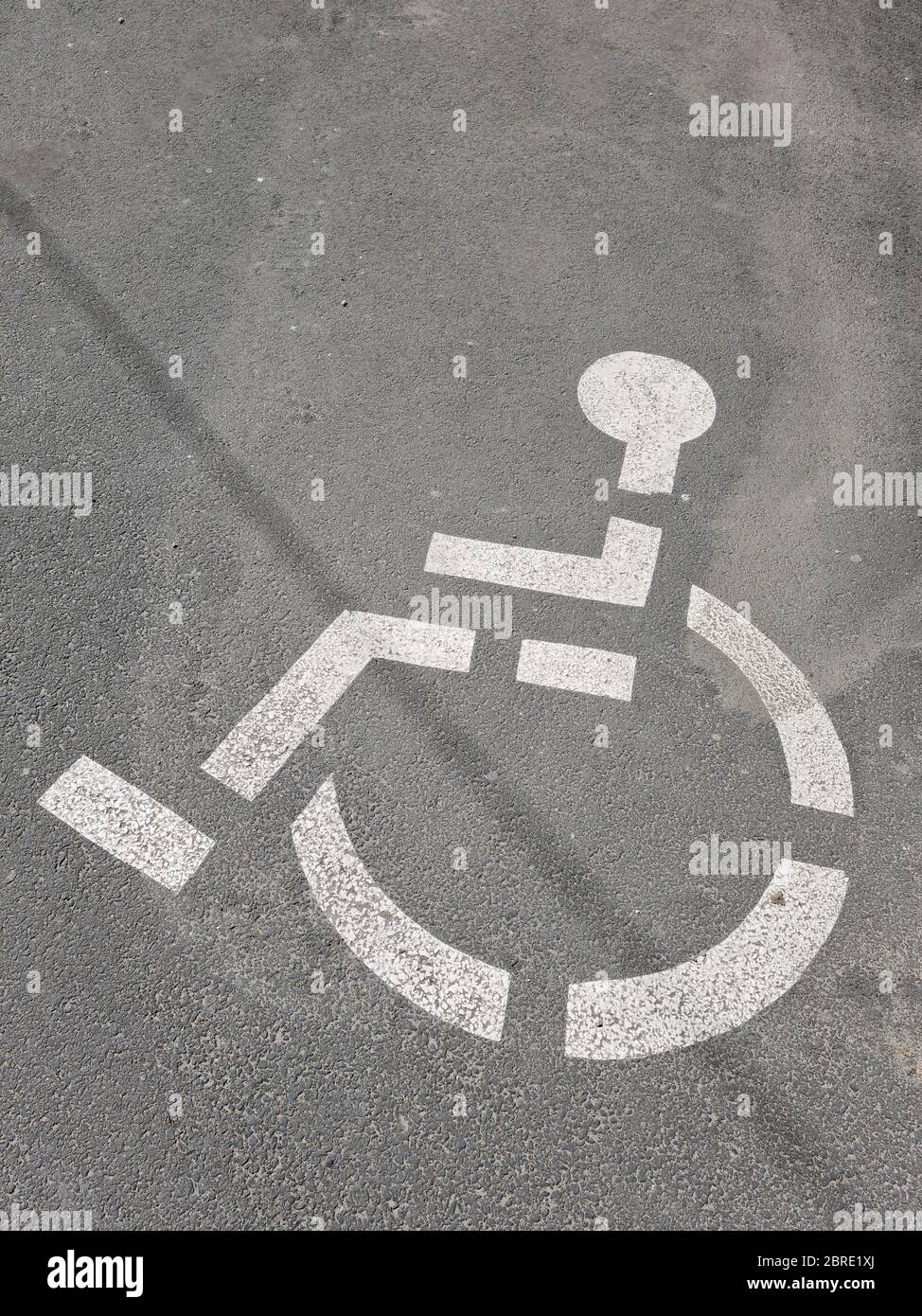 Painted handicap sign in a parking lot Stock Photo - Alamy