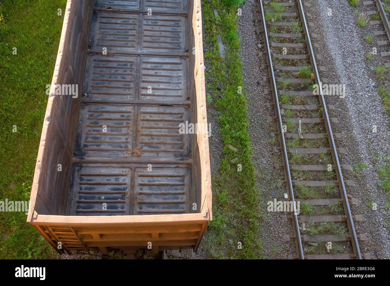 Empty freight wagon on railroad on summer day. Top view Stock Photo - Alamy